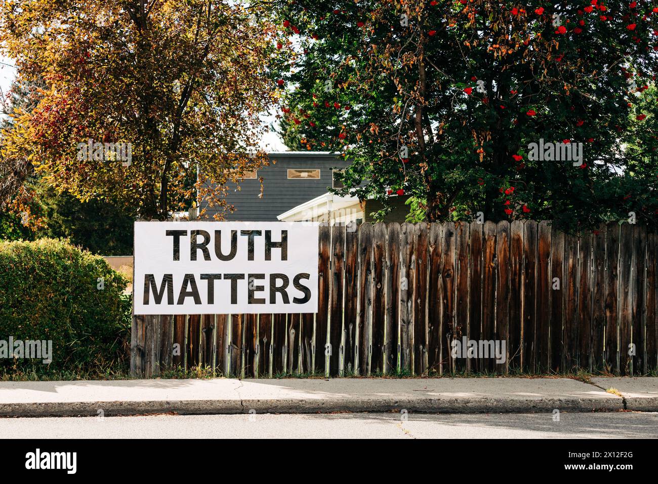 Truth Matters sign hanging on fence outside Stock Photo - Alamy