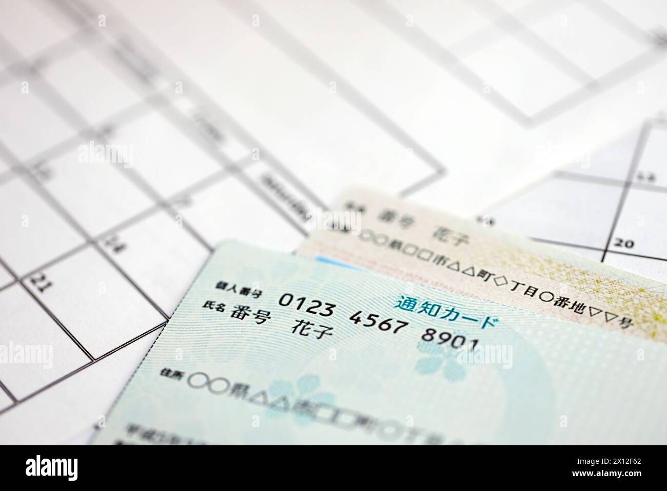 Japanese my number card specimen and notification card on calendar ...