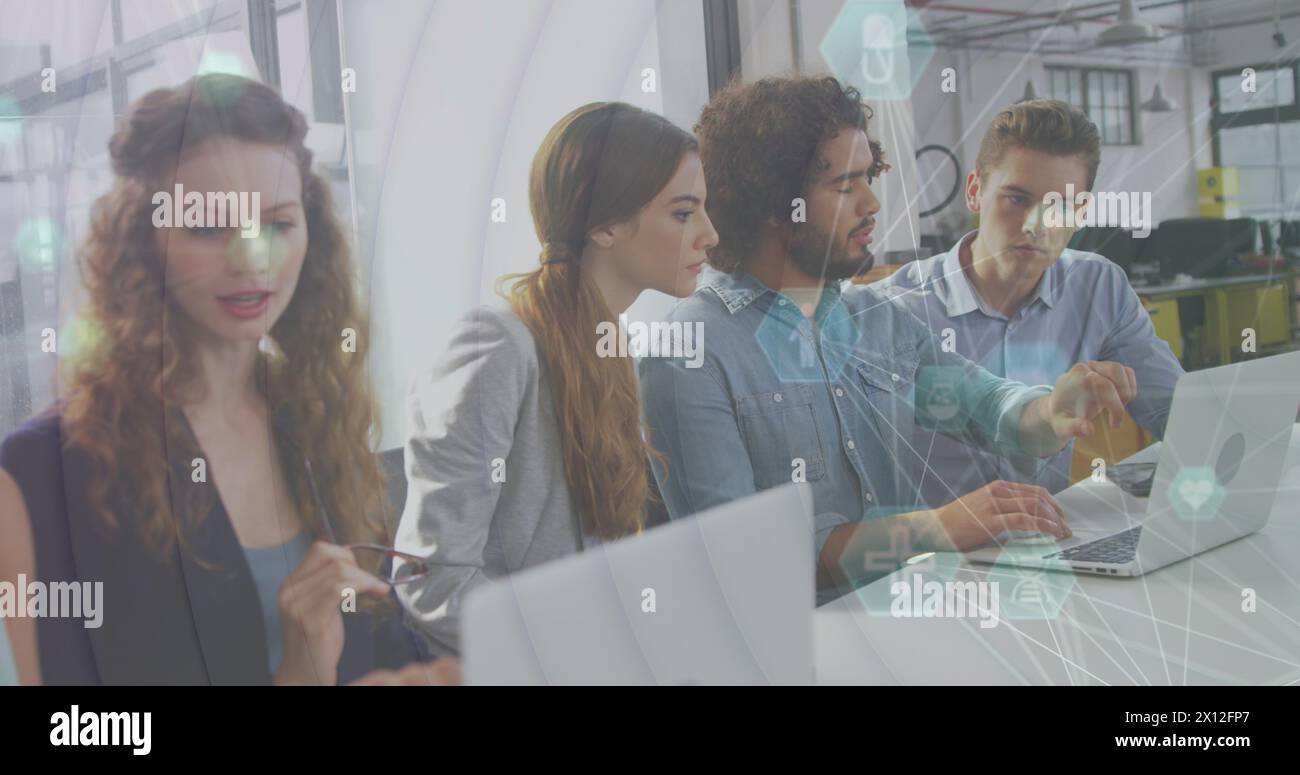 Image of network of connections with icons over diverse female and male ...