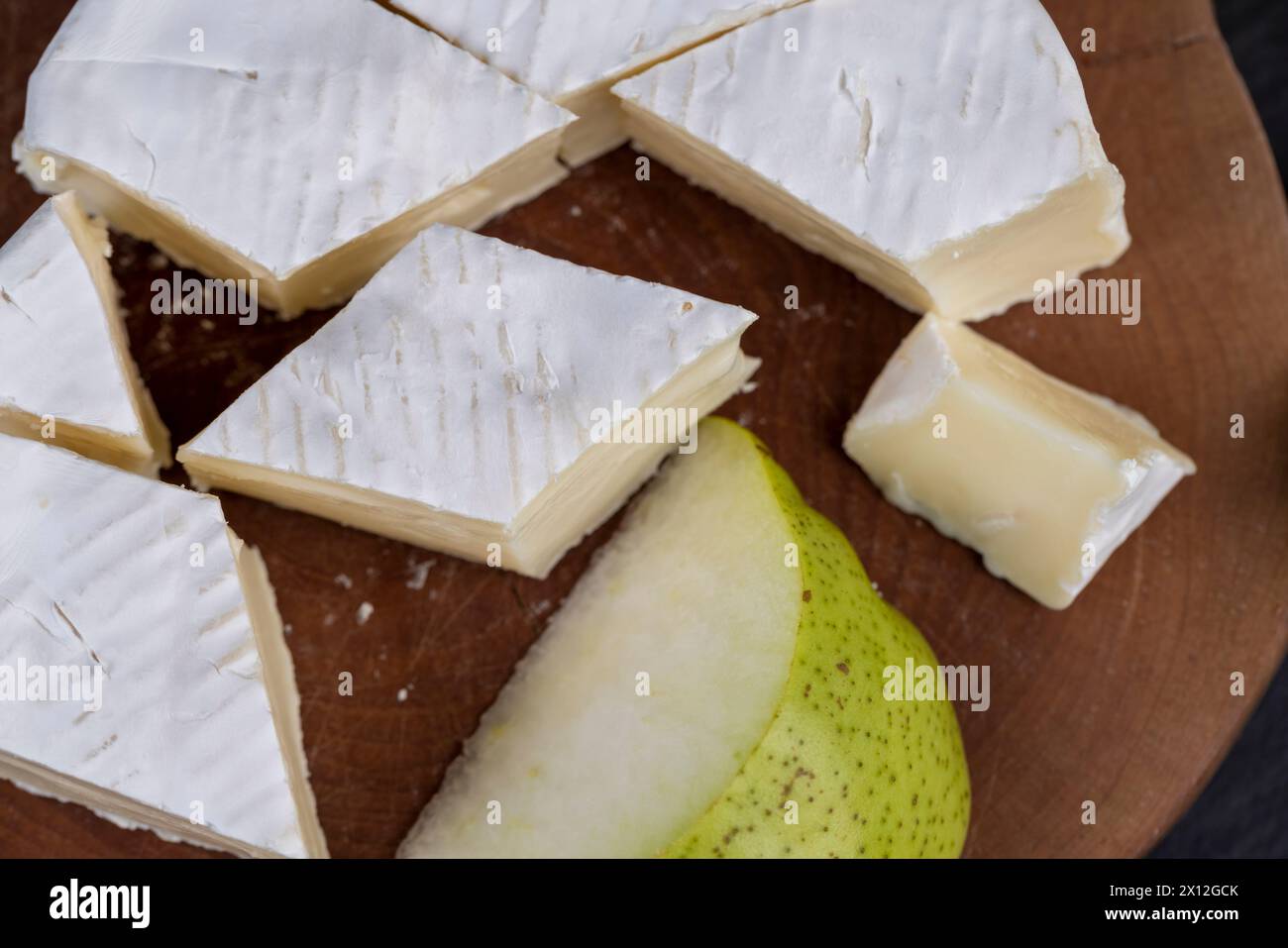 soft fresh hard cheese with white mold, delicious cheese covered with ...