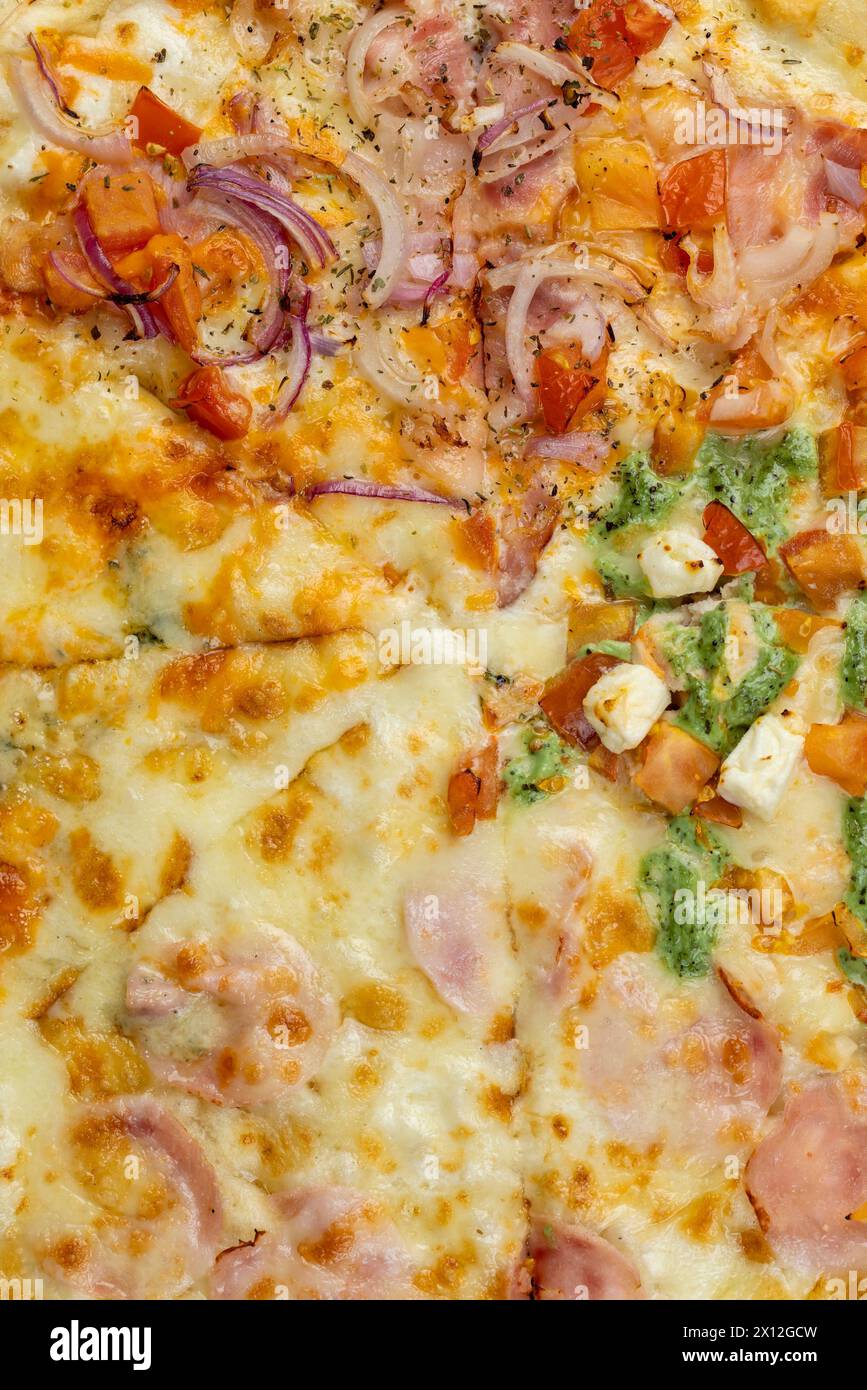 pizza using a large number of different ingredients close-up ...