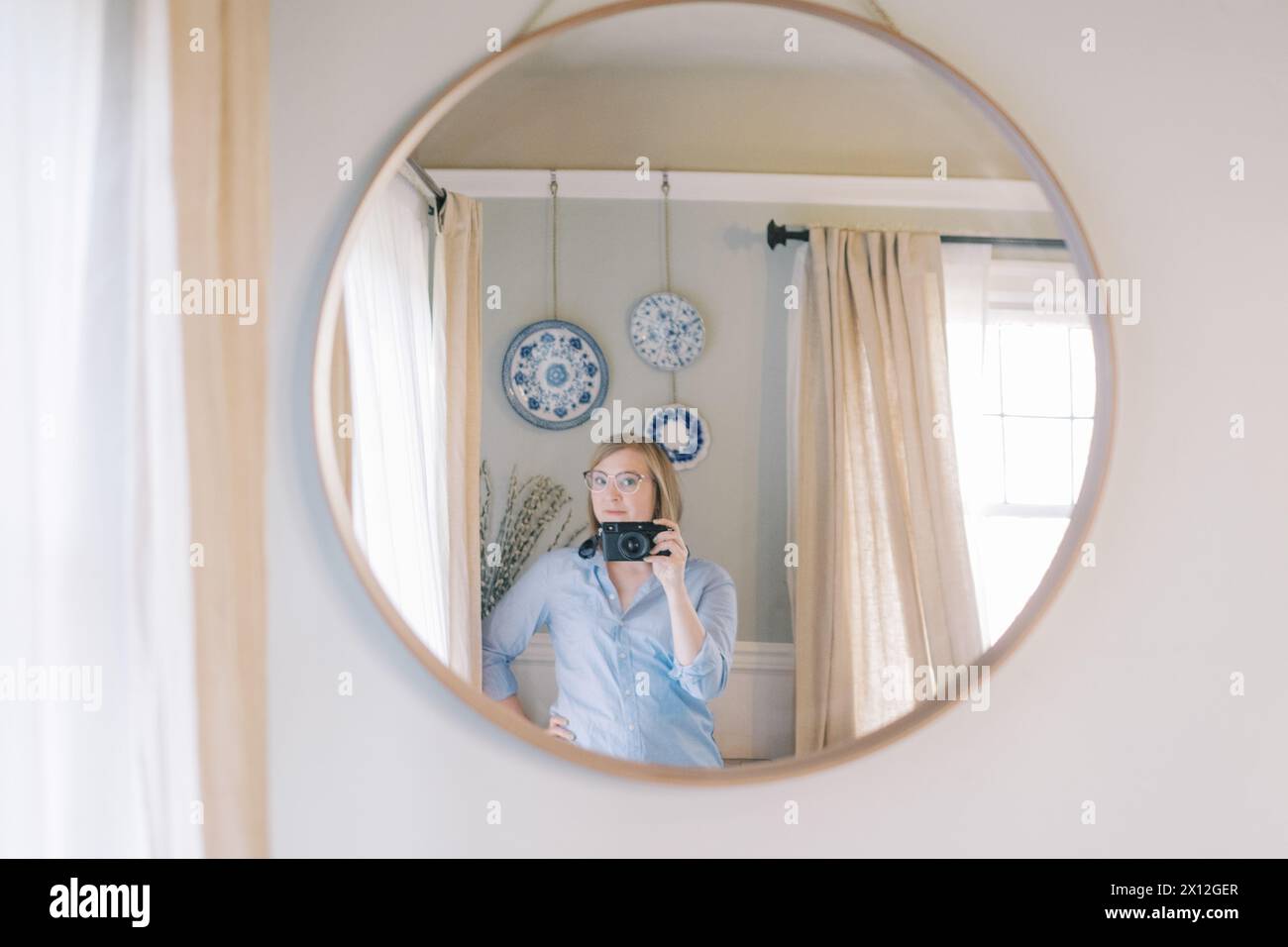 Mirror selfie with vintage decor Stock Photo - Alamy