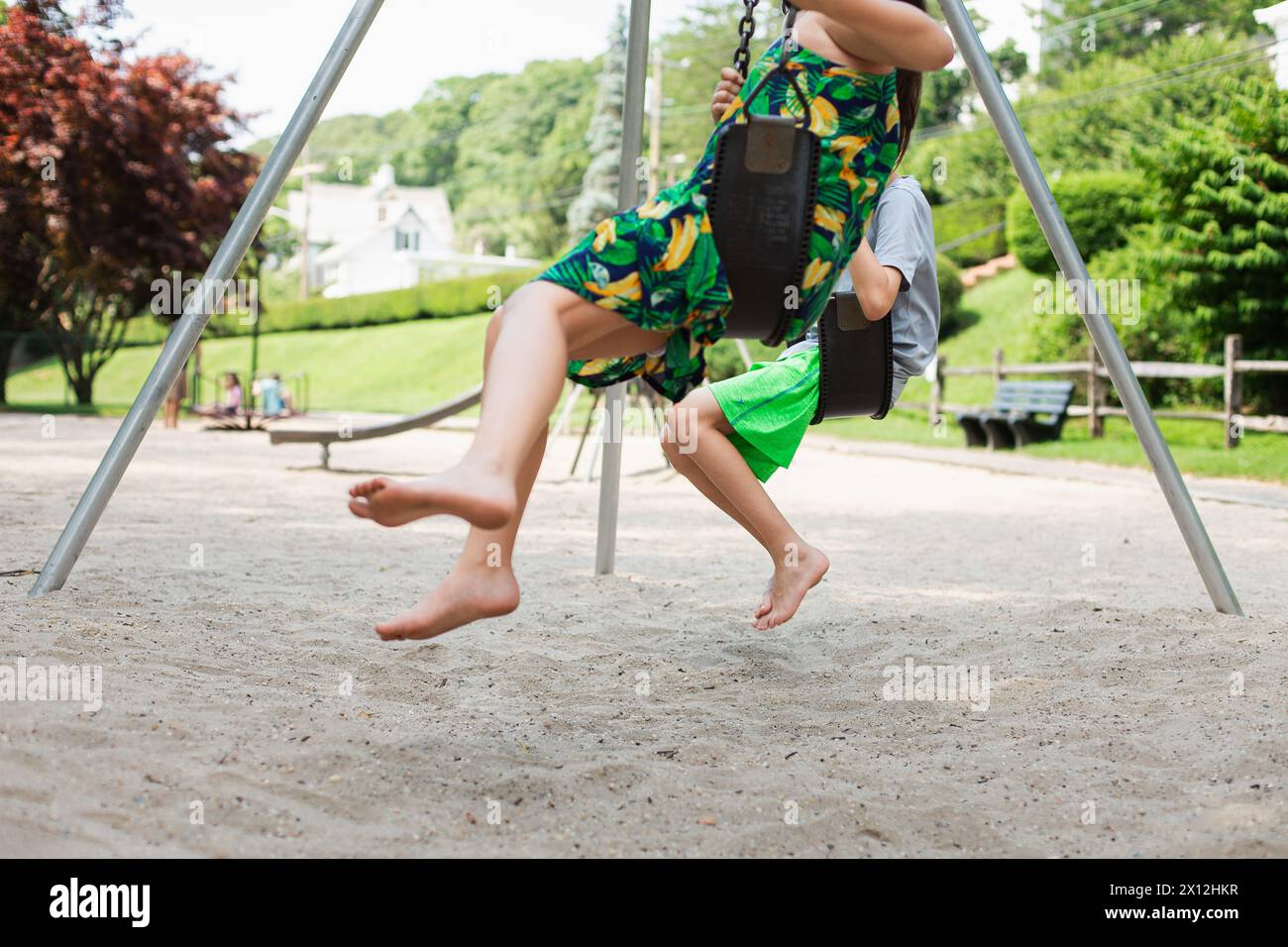 Kids play on swings hi-res stock photography and images - Alamy