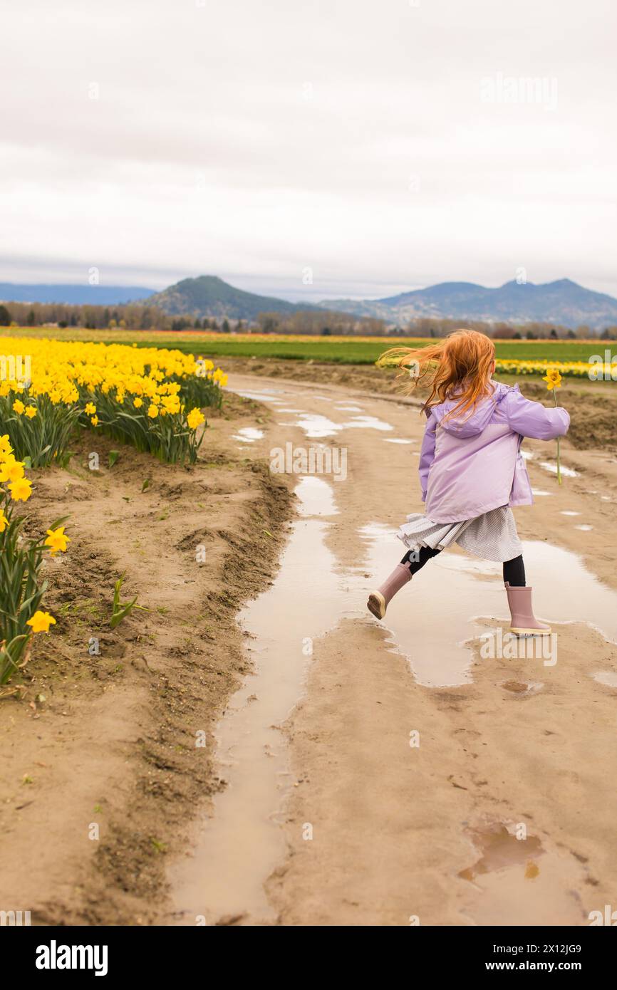 Kids jumping puddle hi-res stock photography and images - Alamy