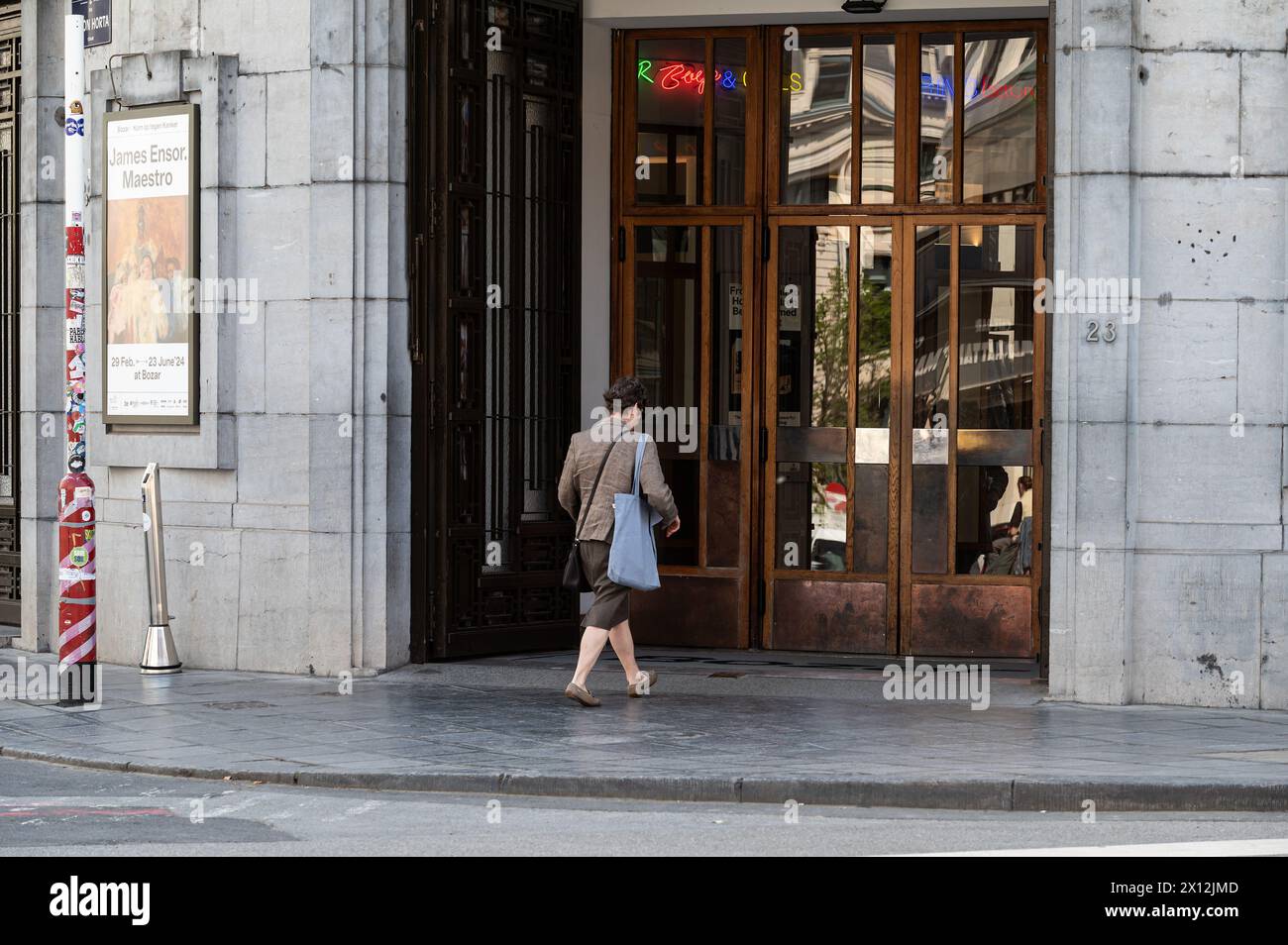 Brussels city center, Belgium - April 13, 2024 - Elderly lady entering ...