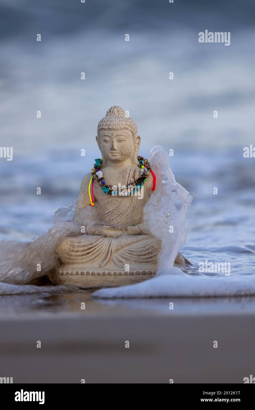 Buddha statue on the beach Stock Photo - Alamy