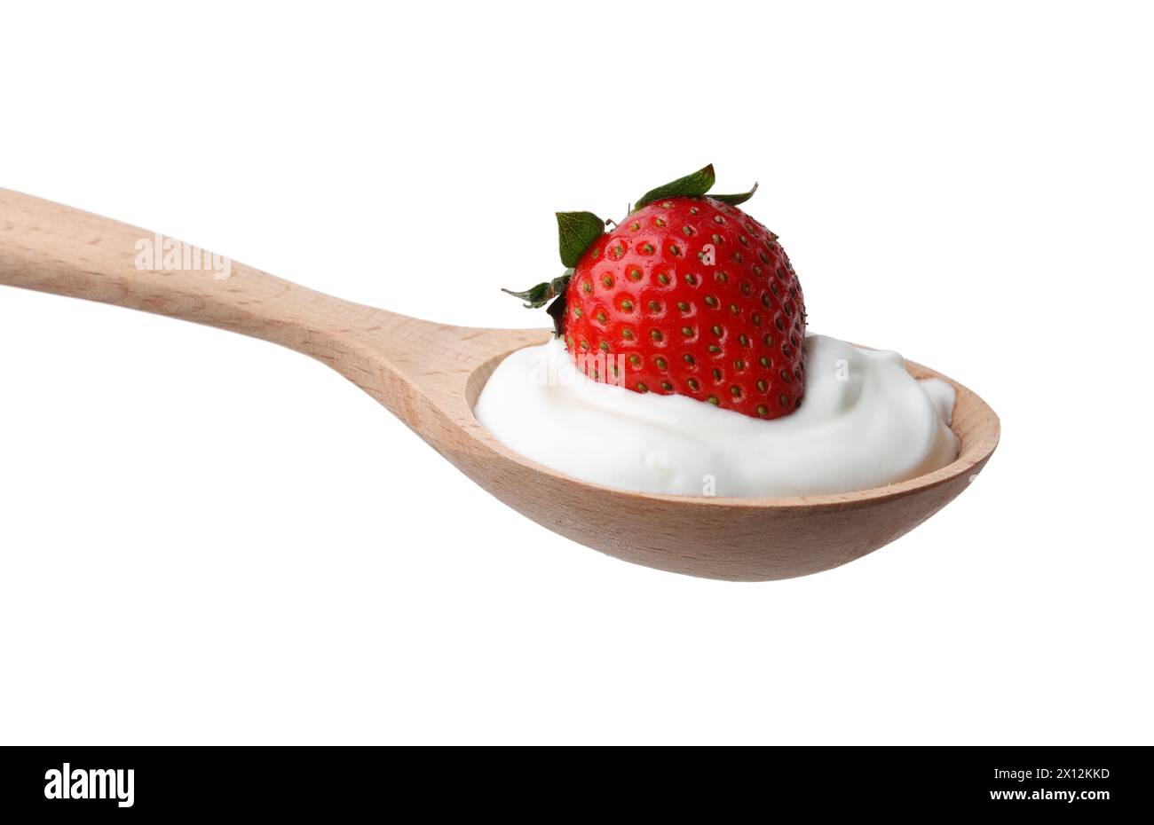 Wooden spoon with yogurt and strawberry isolated on white Stock Photo ...
