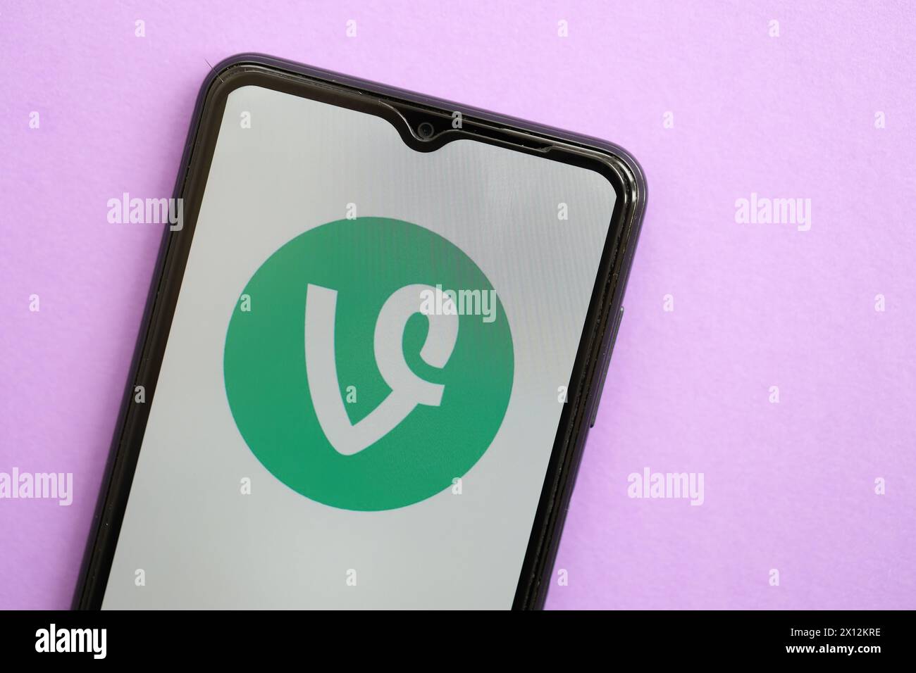 KYIV, UKRAINE - APRIL 1, 2024 Vine icon on smartphone screen on purple table close up. iPhone ...