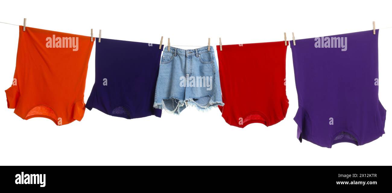 Different clothes drying on laundry line against white background Stock ...