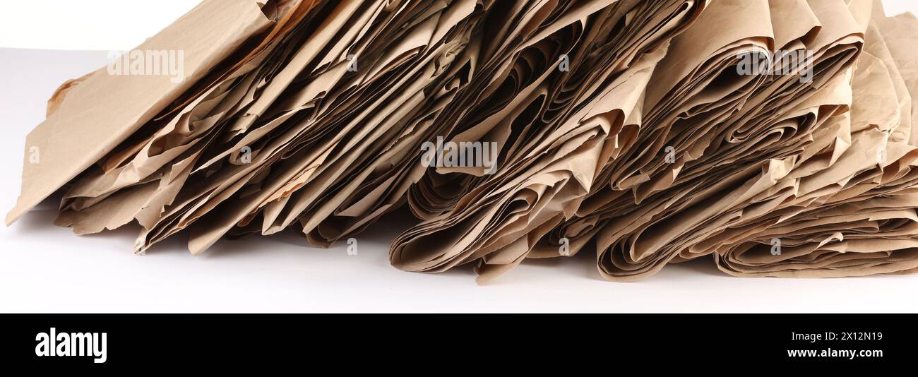Pile of waste paper isolated on white Stock Photo - Alamy