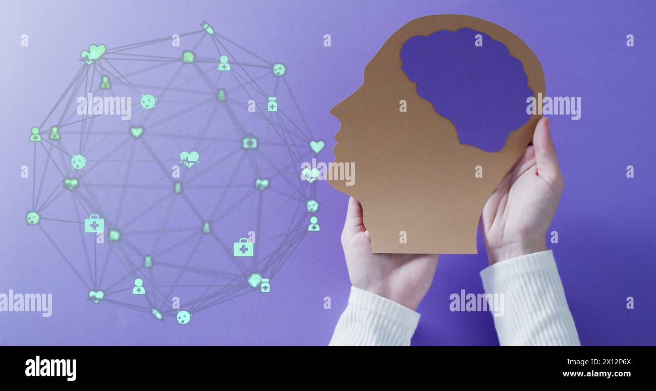 Image of globe of connections with icons over hands holding human head ...