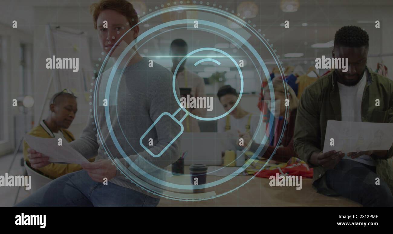 Image of cyber security text and magnifying glass over diverse designers working in office Stock ...