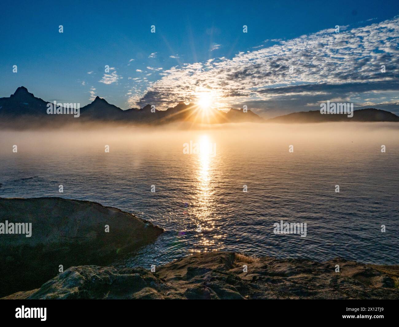 Morning atmosphere in the fjord of Tasiilaq. Sunrise in the bay of ...