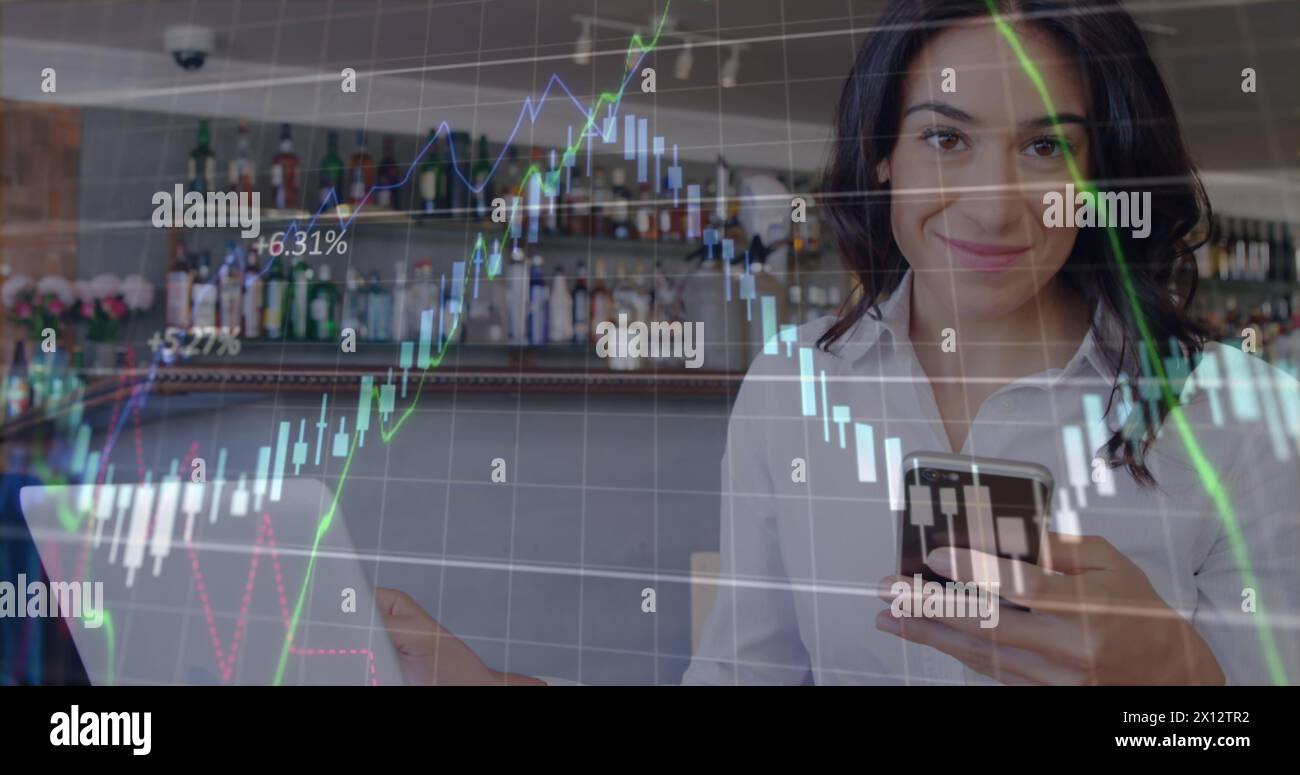 Image of graphs and changing numbers, smiling caucasian woman with ...