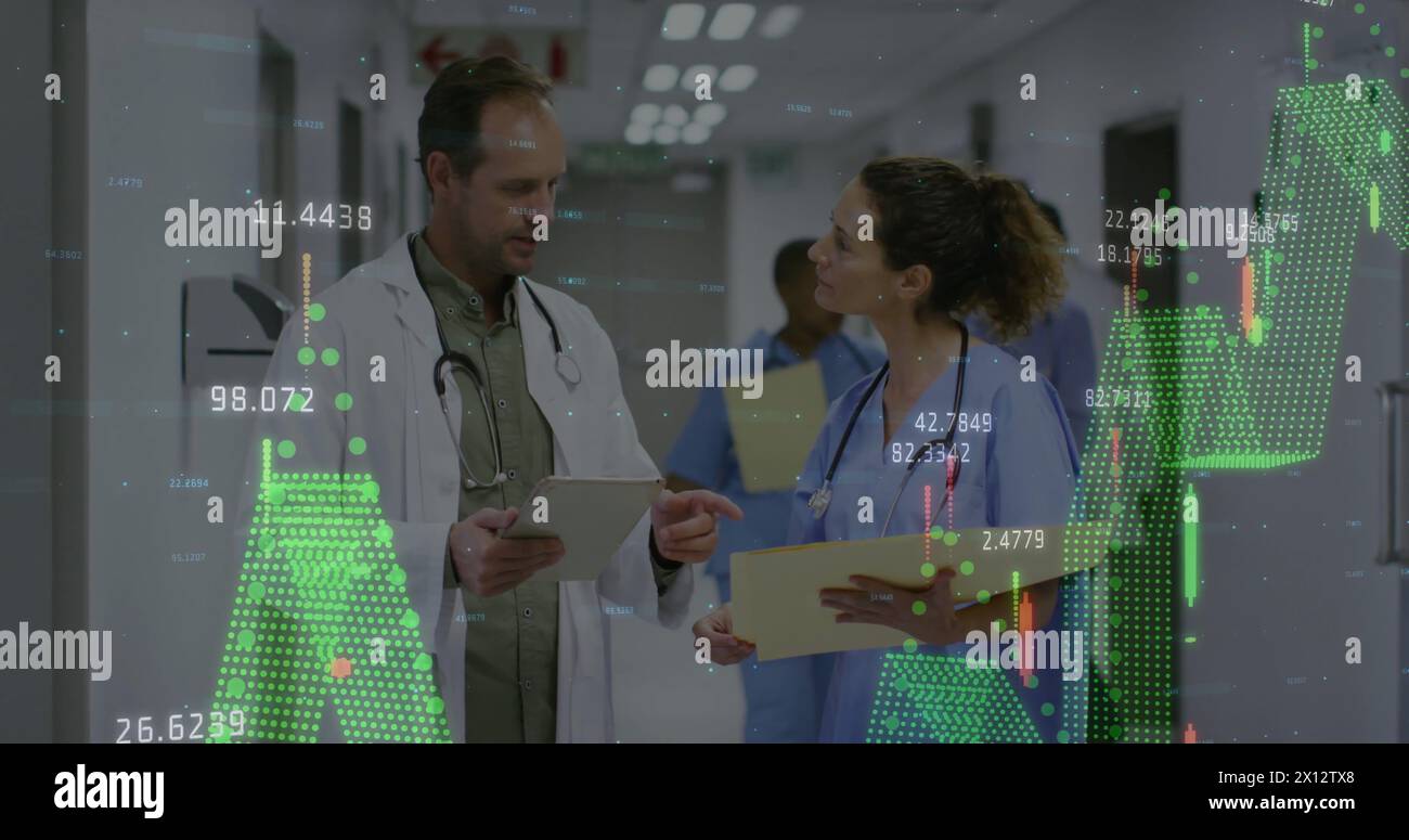 Image of graphs, changing numbers over caucasian doctor standing and ...