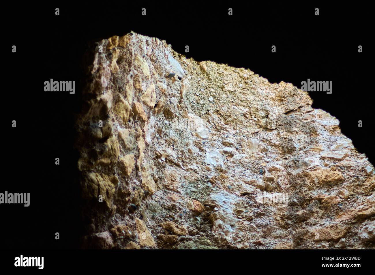 Rock surface, showing the rich texture and varied colors of the mineral ...