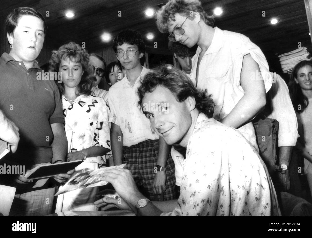 Austria's Formula 1-star Gerhard Berger signs autographs for his fans ...