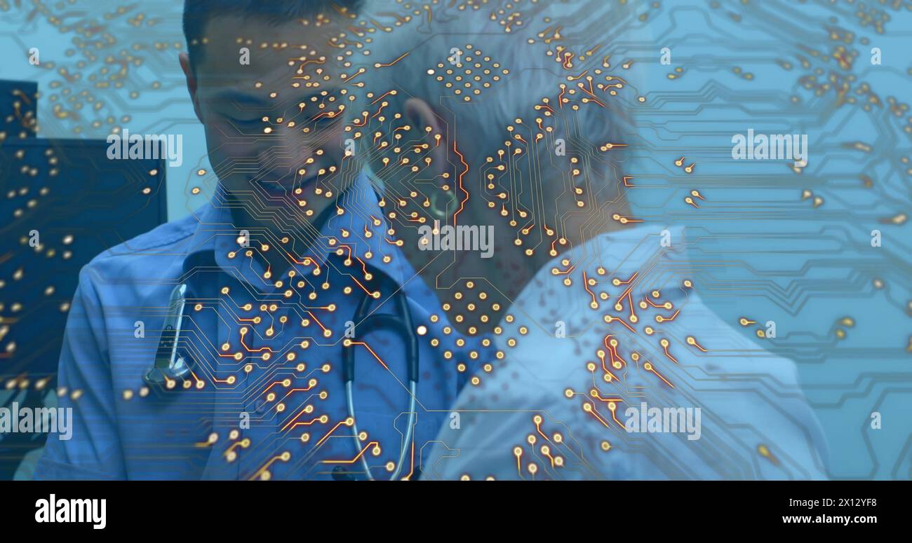 Microprocessor connections against asian male doctor examining ...