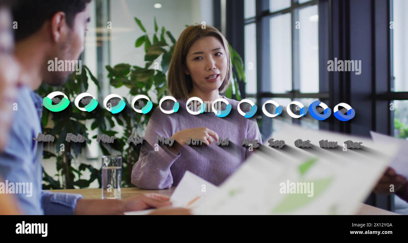 Diverse colleagues discussing data world hi-res stock photography and ...