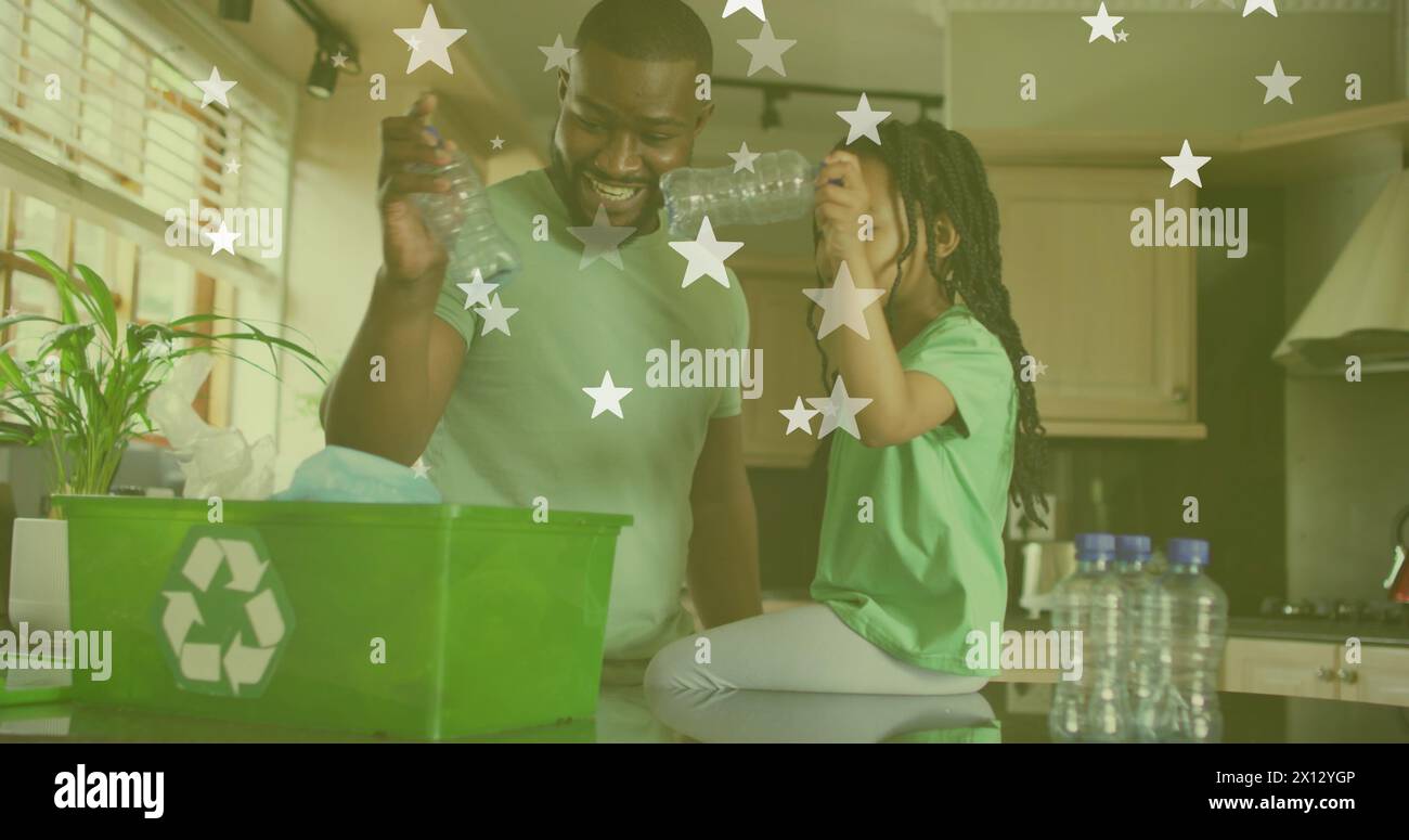 Image of stars icons over african american father and daughter ...