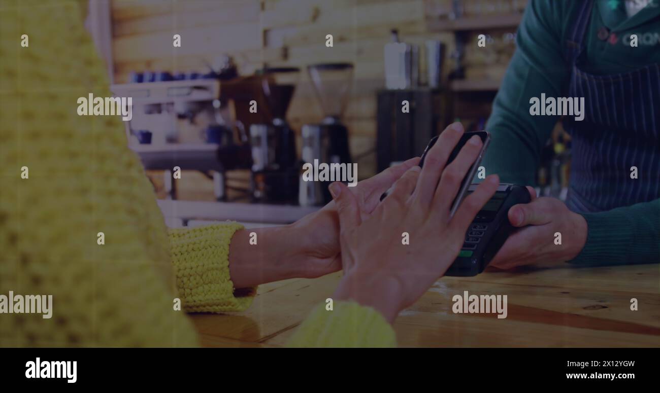 Image of digital data processing over people using a payment terminal ...