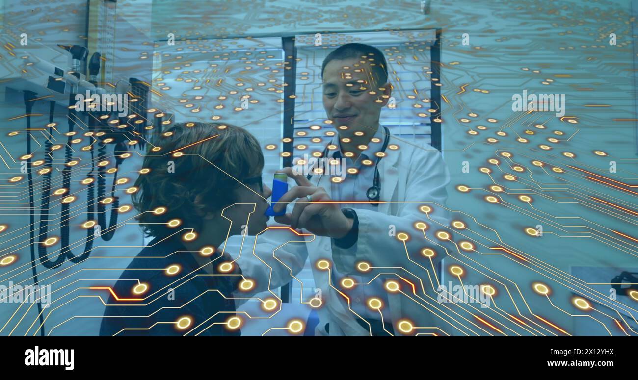 Microprocessor connections against asian male doctor teaching to use ...