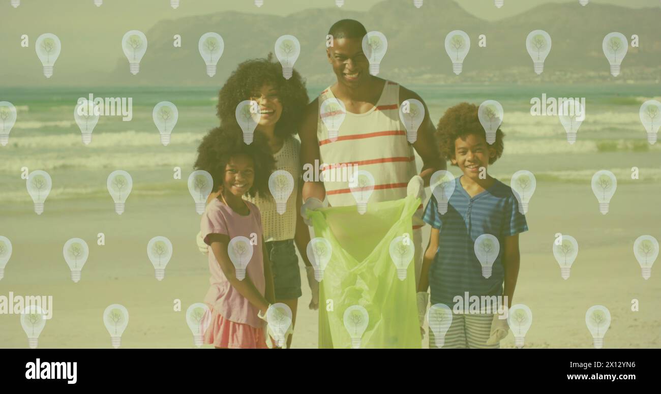 Image of lightbulb icons over african american family segregating waste ...