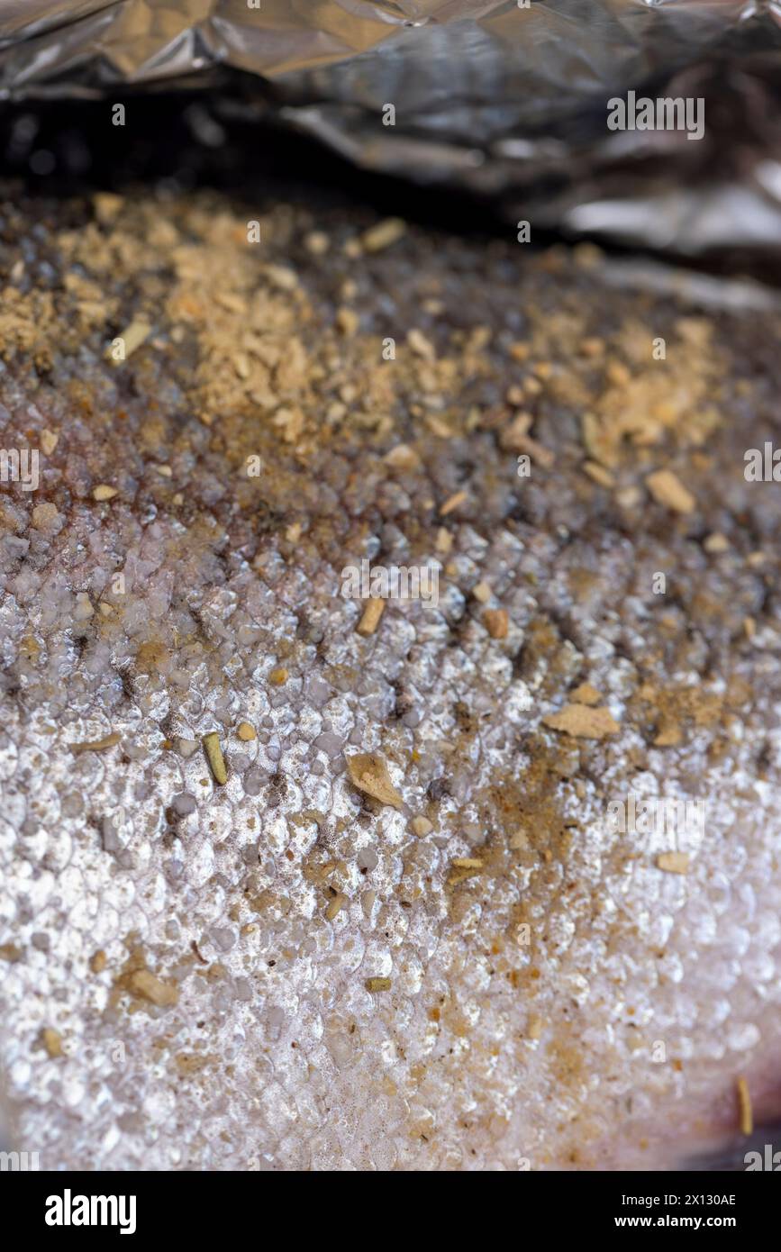 red trout meat in the kitchen, cooking a fish dish with expensive red ...