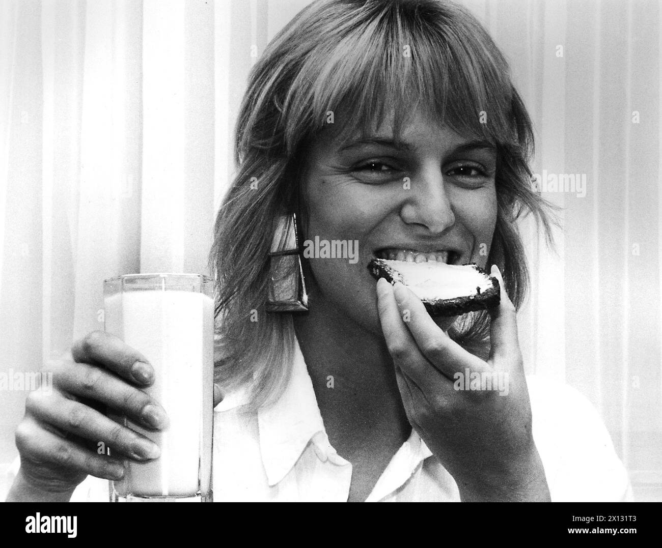 The photo was taken on October 12th 1987 and shows a lady biting into a ...