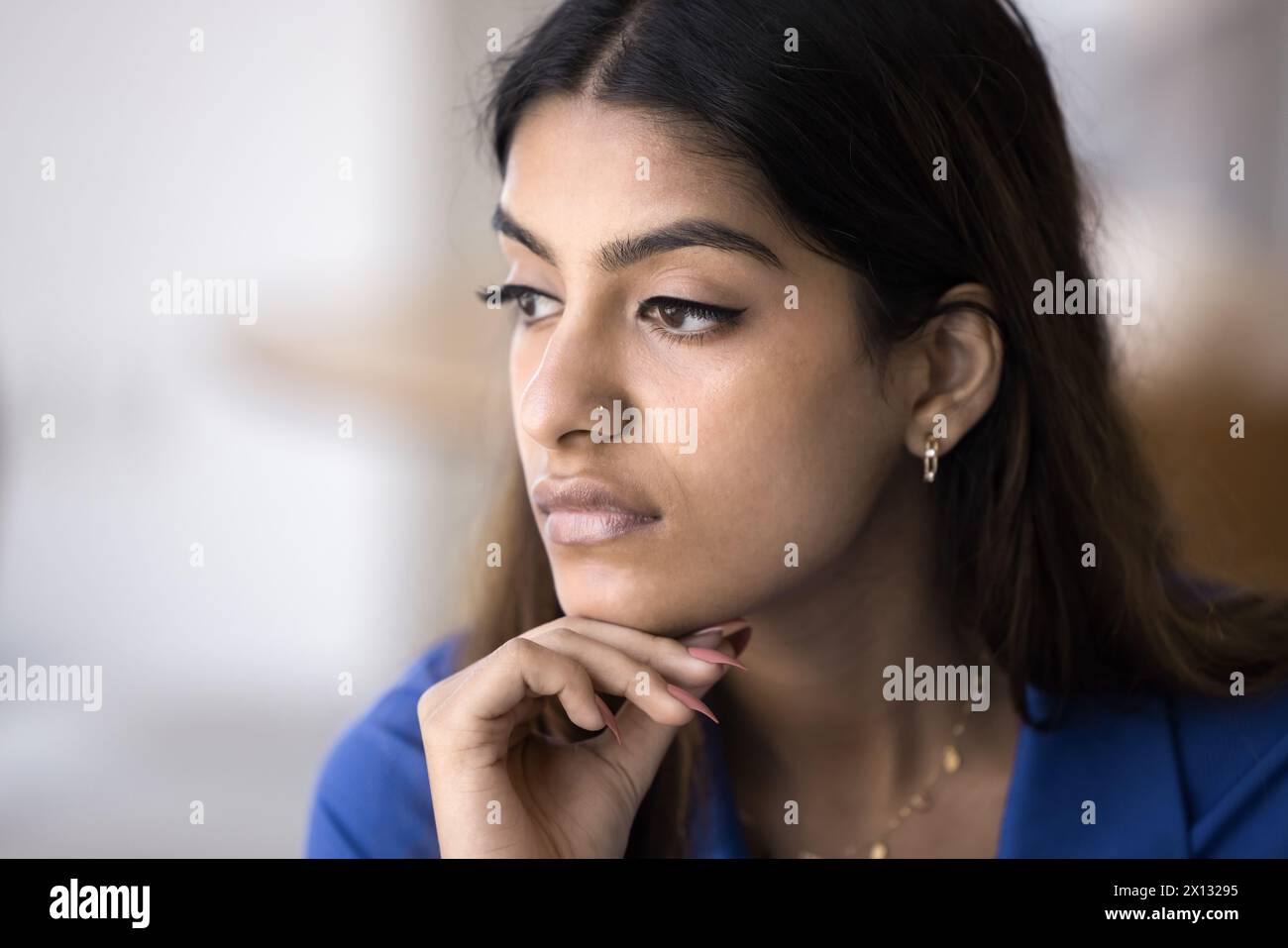 Sad pensive young Indian woman casual close up facial portrait Stock ...