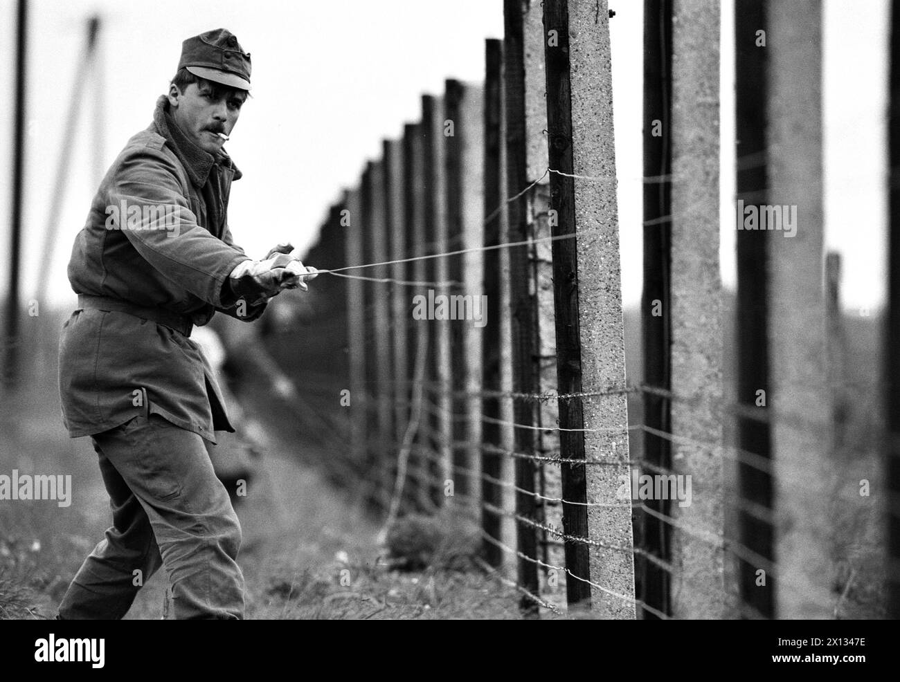 Hungarian soldiers destroy the Iron Curtain between Austria and Hungary ...