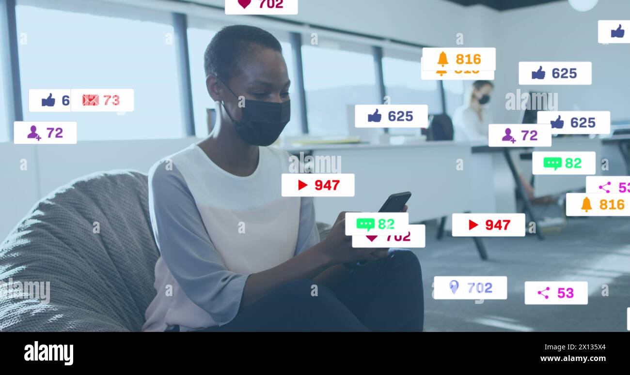 Image of social media icons over african american woman with face mask ...