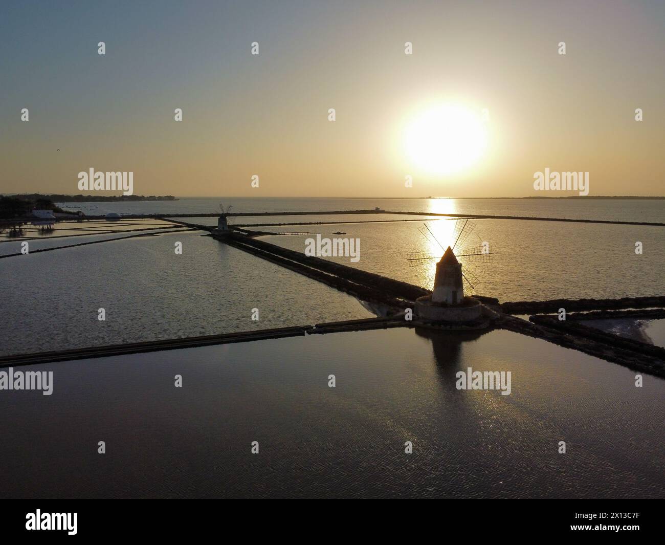 aerial view of the Stagnone salt pans and the ancient windmills at ...