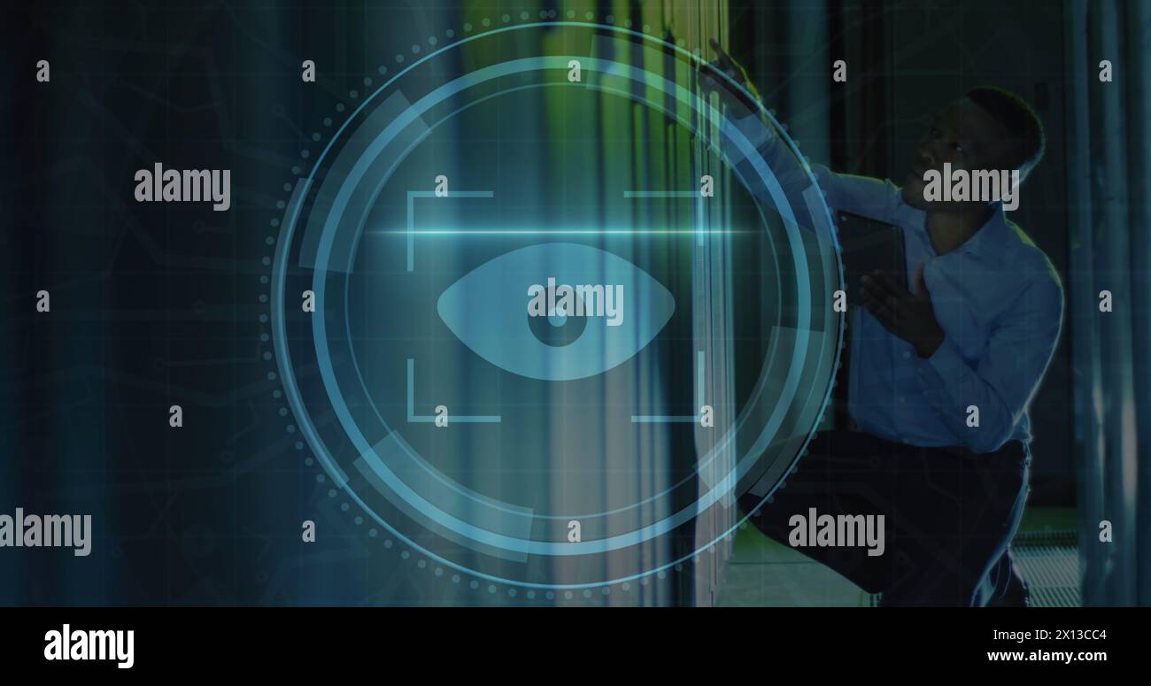 Image of eye retina scanner over african american male engineer using ...
