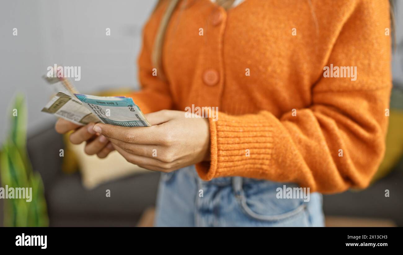 Indian woman counting money hi-res stock photography and images - Alamy