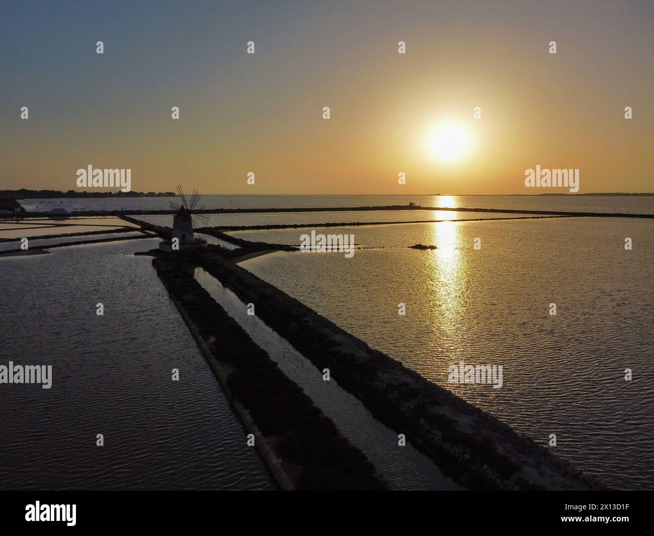 aerial view of the Stagnone salt pans and the ancient windmills at ...