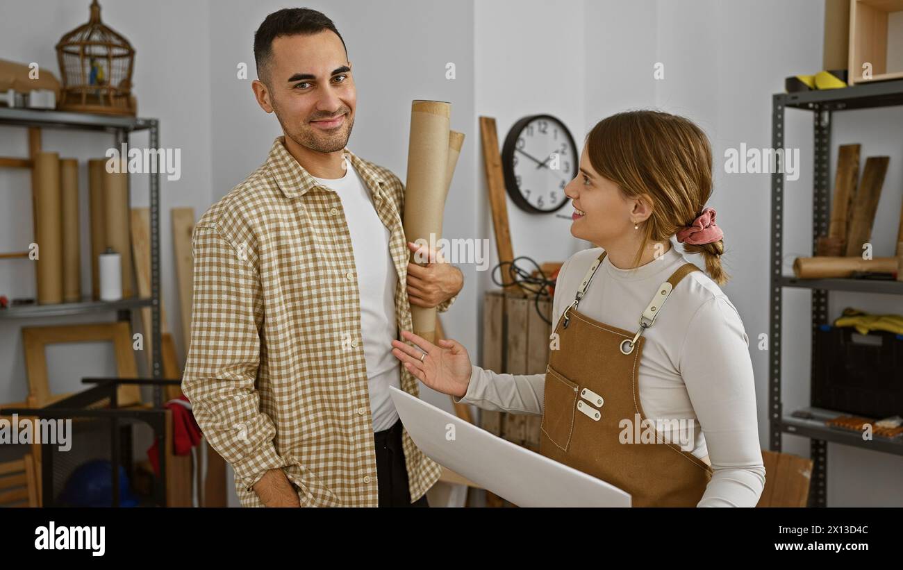 Man and woman collaborate in a well-organized carpentry workshop ...