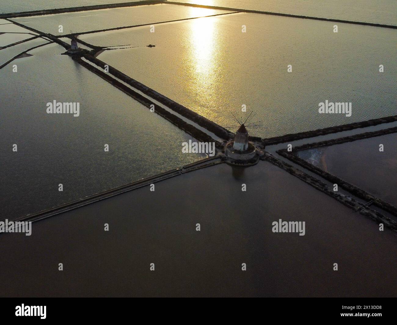 aerial view of the Stagnone salt pans and the ancient windmills at ...