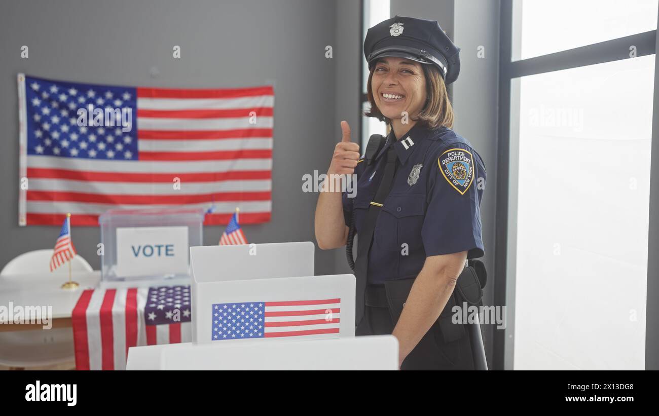 Smiling female police officer giving thumbs up in a voting center with ...
