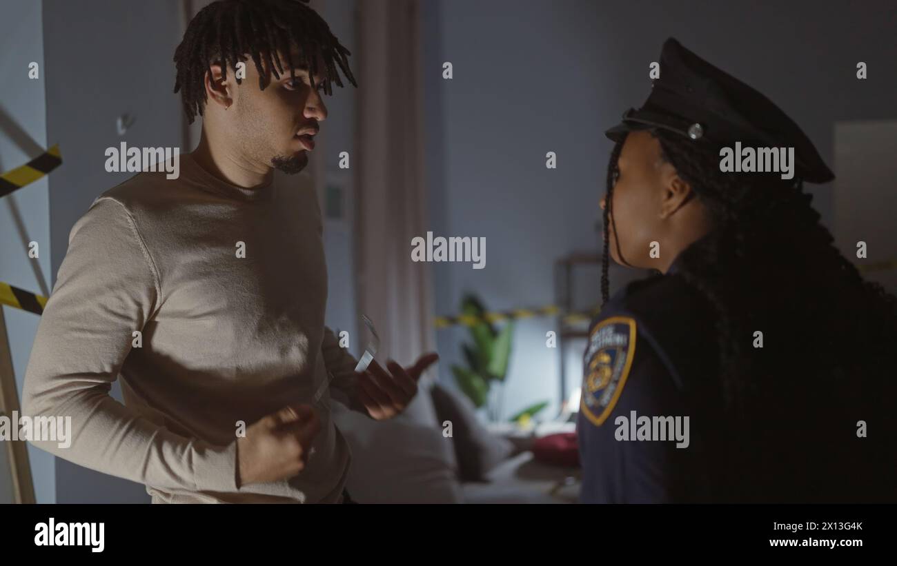 A man and a policewoman engage in a serious conversation indoors ...