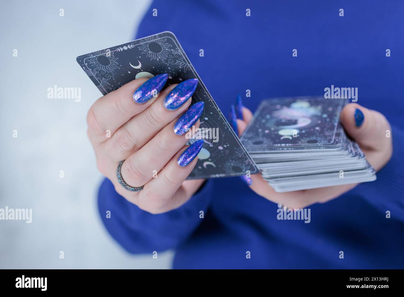 Female hands holding tarot cards for fortune telling and tricks Stock ...