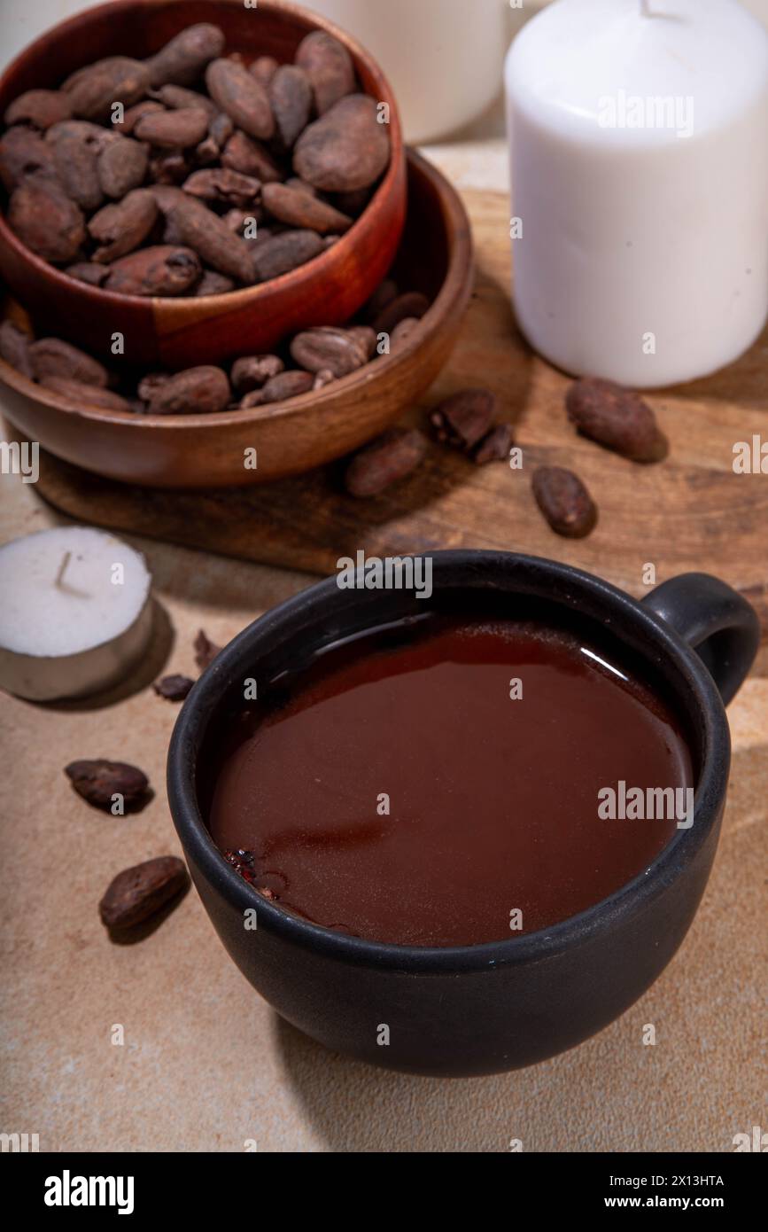 Ceremonial Cacao drink. Hot ceremonial chocolate in black cup with ...
