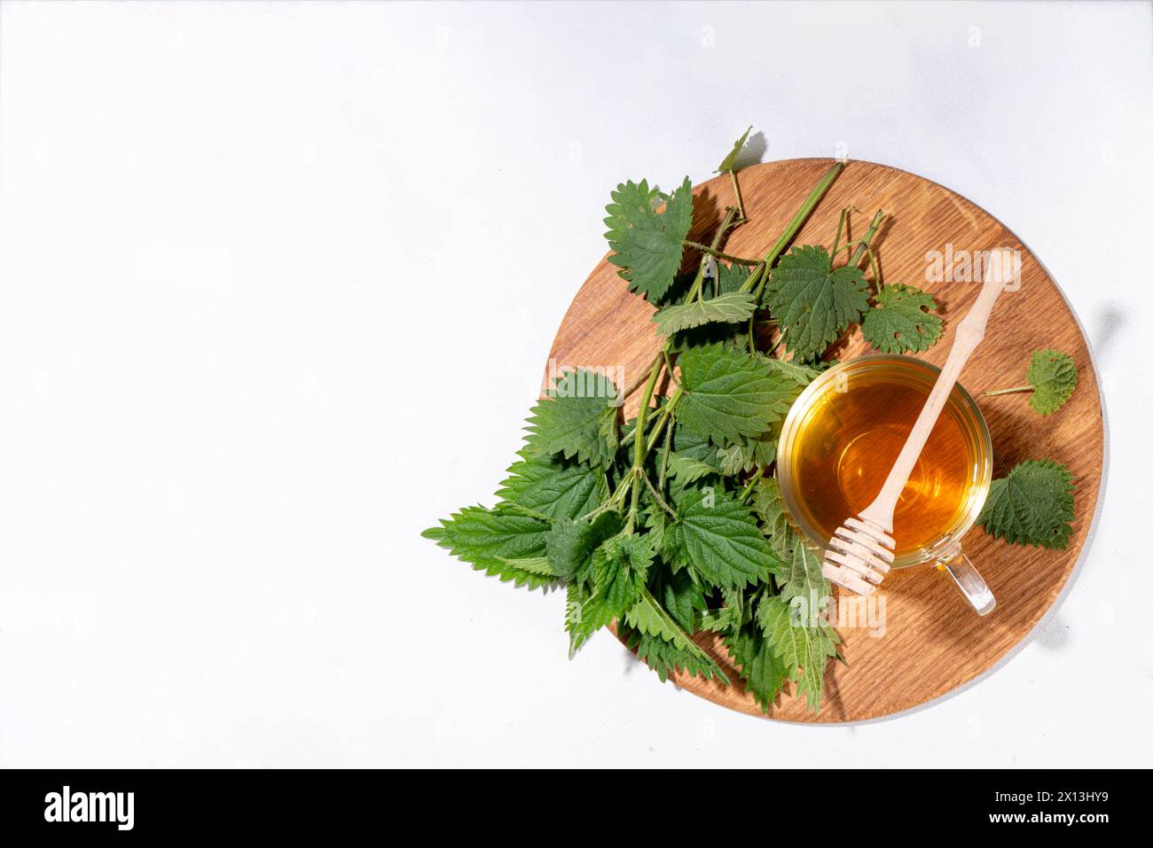 Nettle Tea hot plant drink in transparent glass cup. Organic natural ...