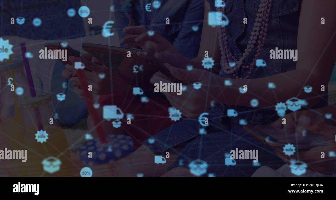 Image of web of connections with icons floating over a group of people ...