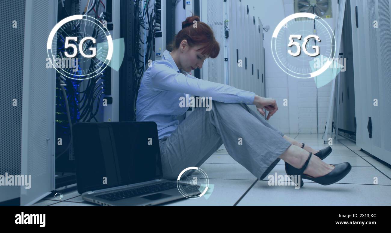 Digital composite of a Caucasian woman sitting beside a laptop in a ...