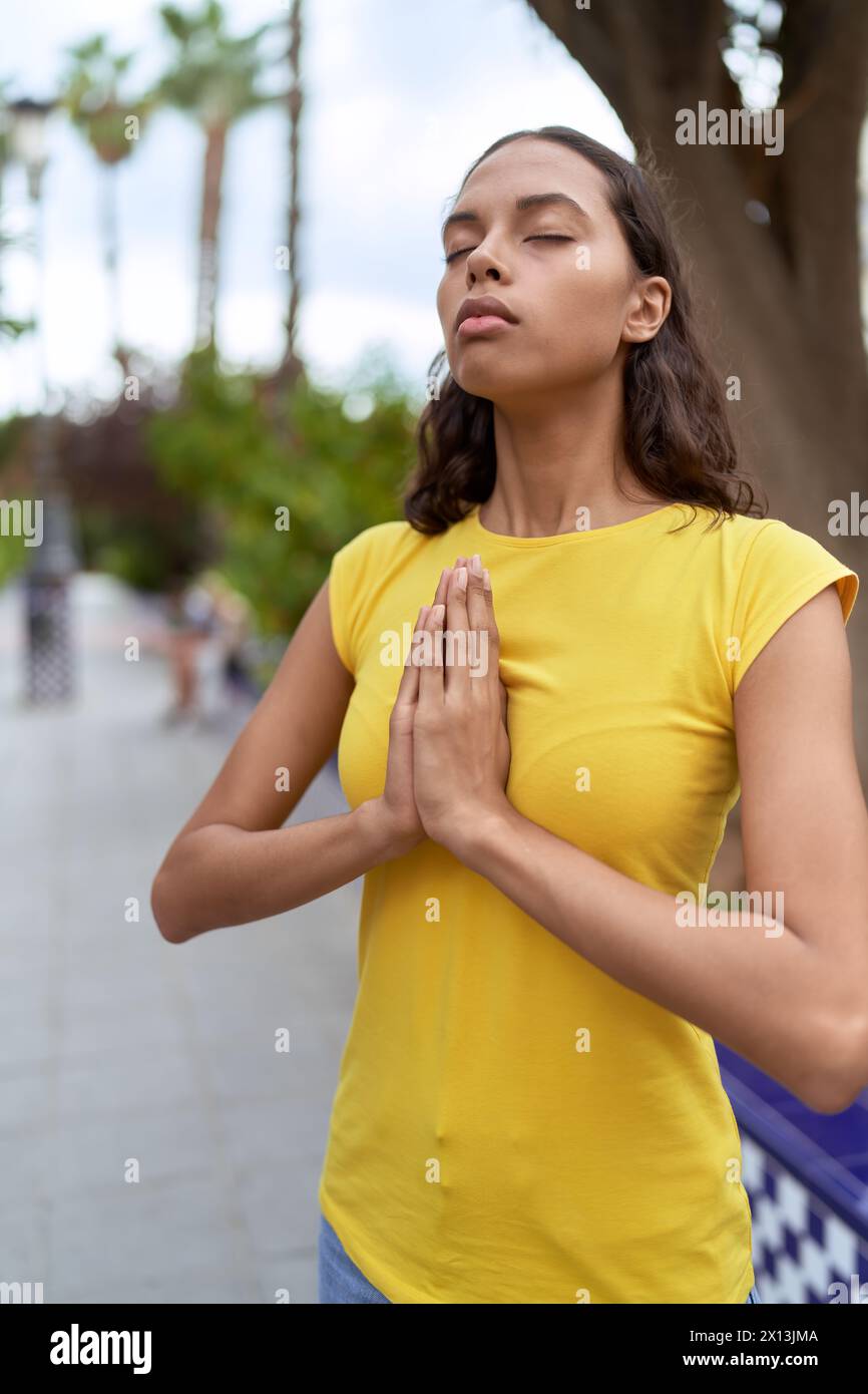 Young beautiful woman praying street hi-res stock photography and ...