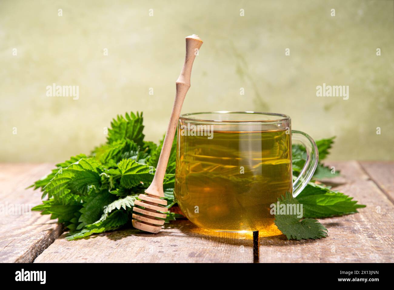 Nettle Tea hot plant drink in transparent glass cup. Organic natural ...