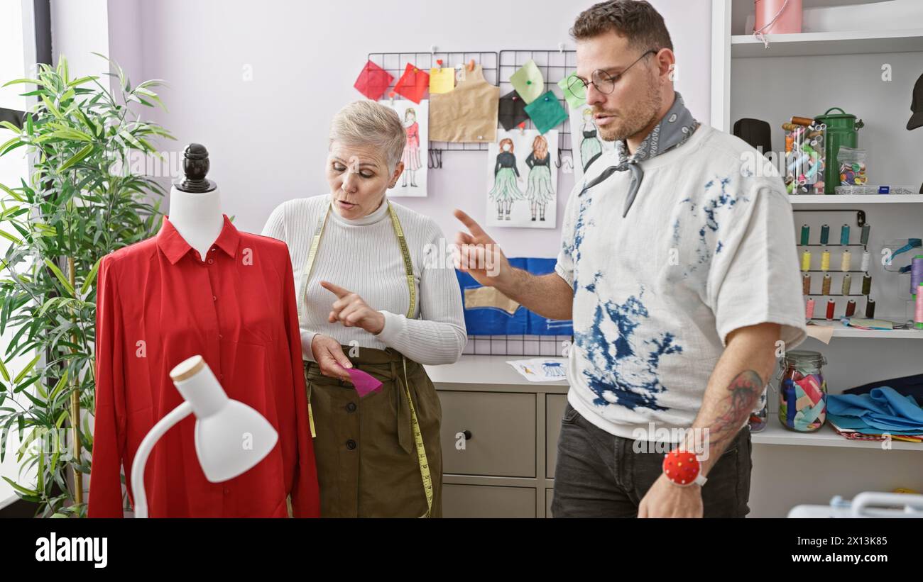 Two Tailors A Woman And A Man Collaborating In A Tailor Shop With