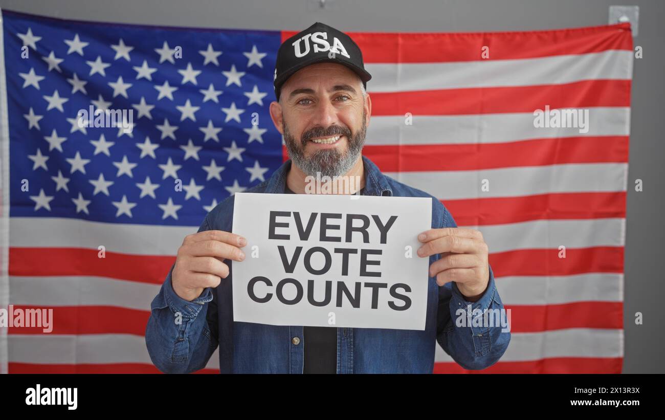 Smiling bearded man holding a 'every vote counts' sign with american ...