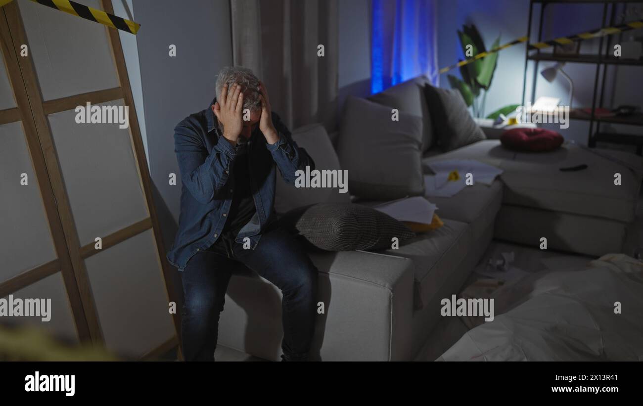 Distraught man in a messy indoor crime scene with caution tape, papers ...